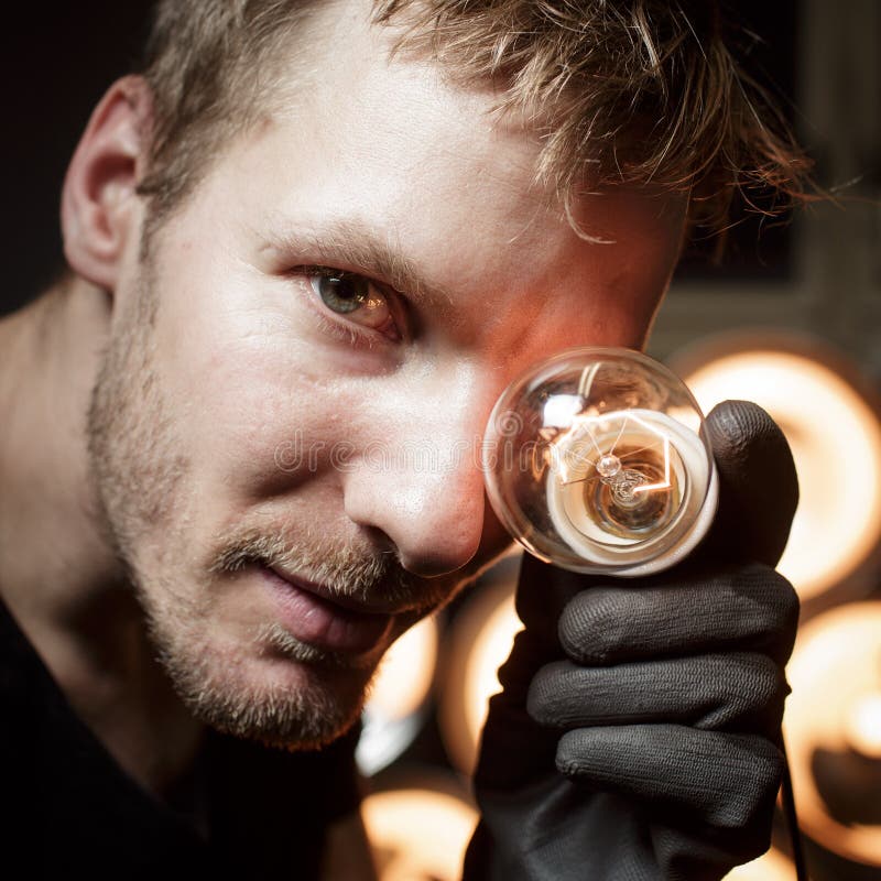 Young Light Designer Looking at Old Electric Bulb Stock Image - Image ...