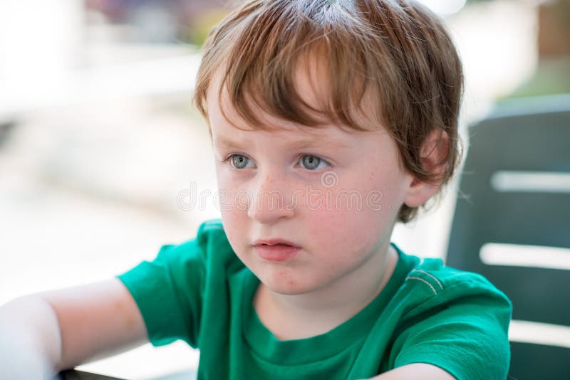 Young Little Boy Sitting Down Outside Stock Image - Image of cheerful ...