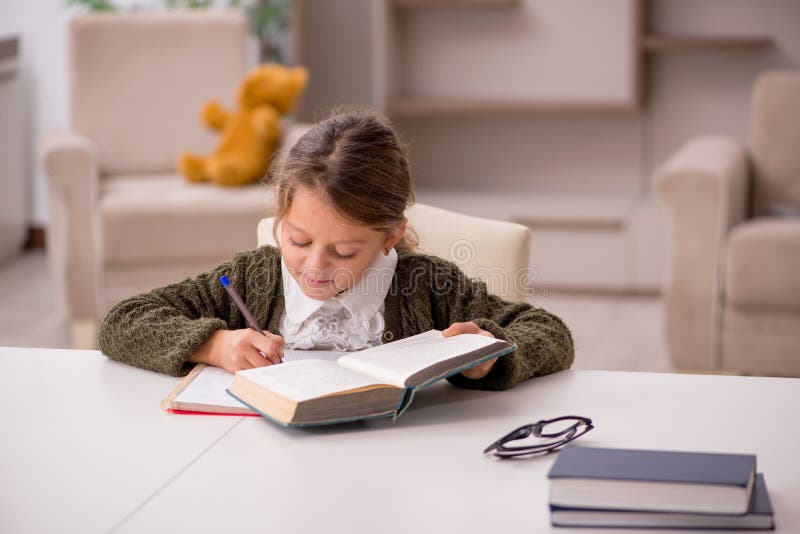 Young Little Girl Studying at Home Stock Photo - Image of preparation ...