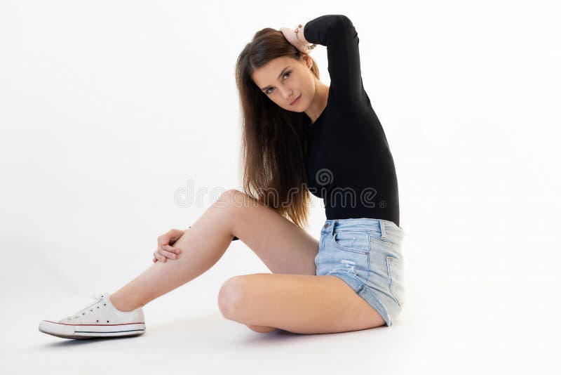 Young Woman Posing Sitting on Floor and Looking at Camera Stock Photo - Image of cute, elegant ...