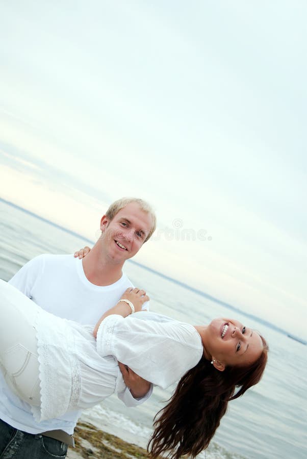 Young Lovers Having Fun on the Beach Stock Image - Image of body, love ...