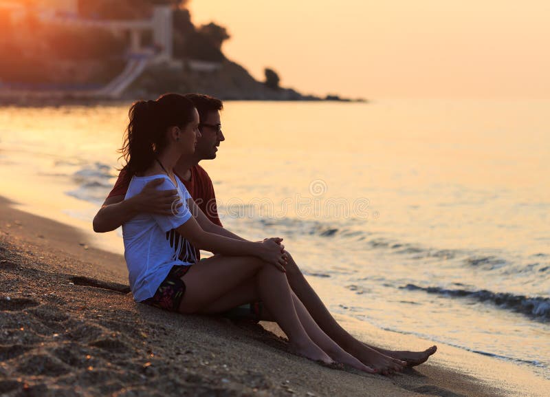 Young Lovers Sitting on Wooden Bench Stock Photo - Image of couple ...