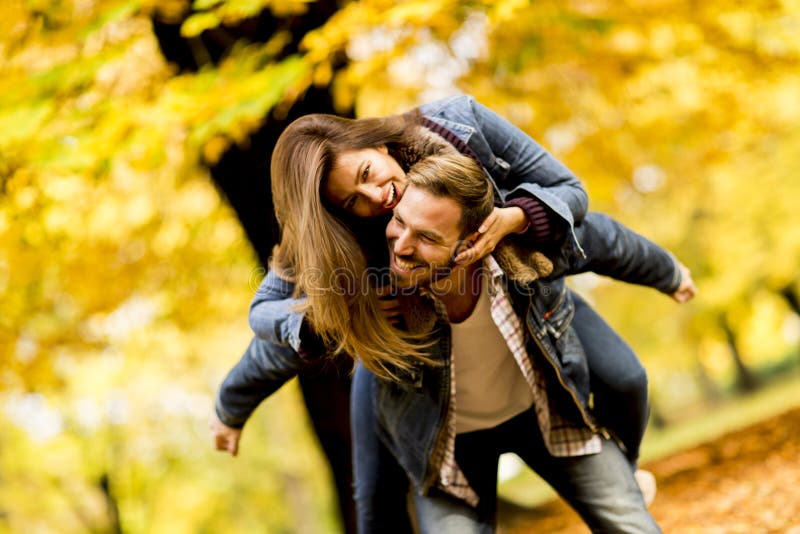Young Loving Couple Having Fun in the Autumn Park Stock Image - Image ...