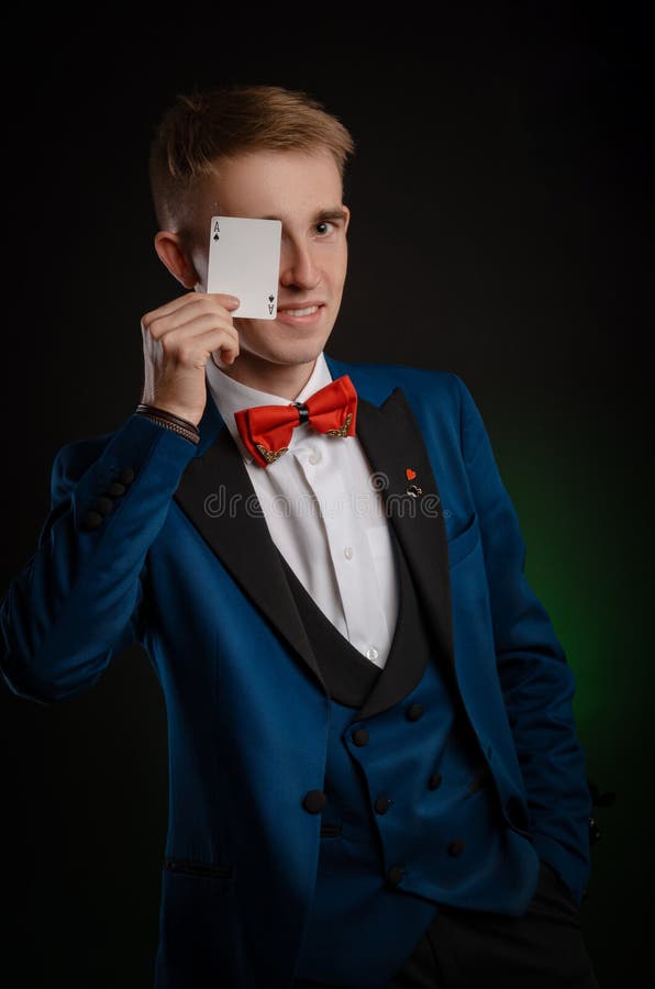 A Young Magician Guy is Holding Cards in His Hands Stock Photo - Image ...