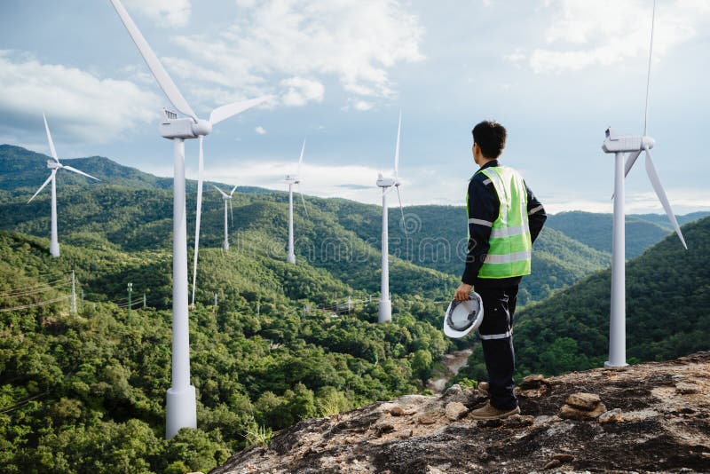 Young Maintenance Engineer Man Working in Wind Turbine on the Mountain ...