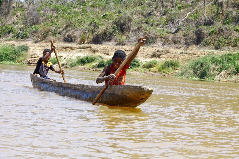 Young Malagasy African Boy Rowing Traditional Canoe Stock Photo - Image ...