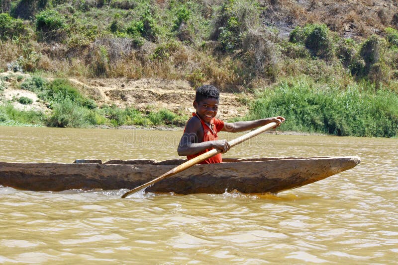 Young Malagasy African Boy Rowing Traditional Canoe Stock Image - Image ...