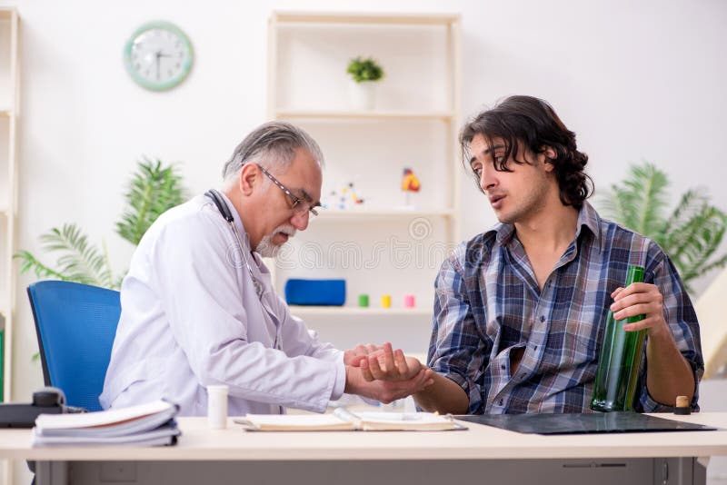 Young Male Alcoholic Visiting Old Doctor Stock Photo - Image of booze ...