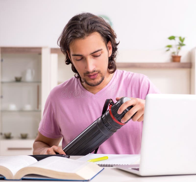 Young Male Architect Student Preparing for Exams at Home Stock Photo ...