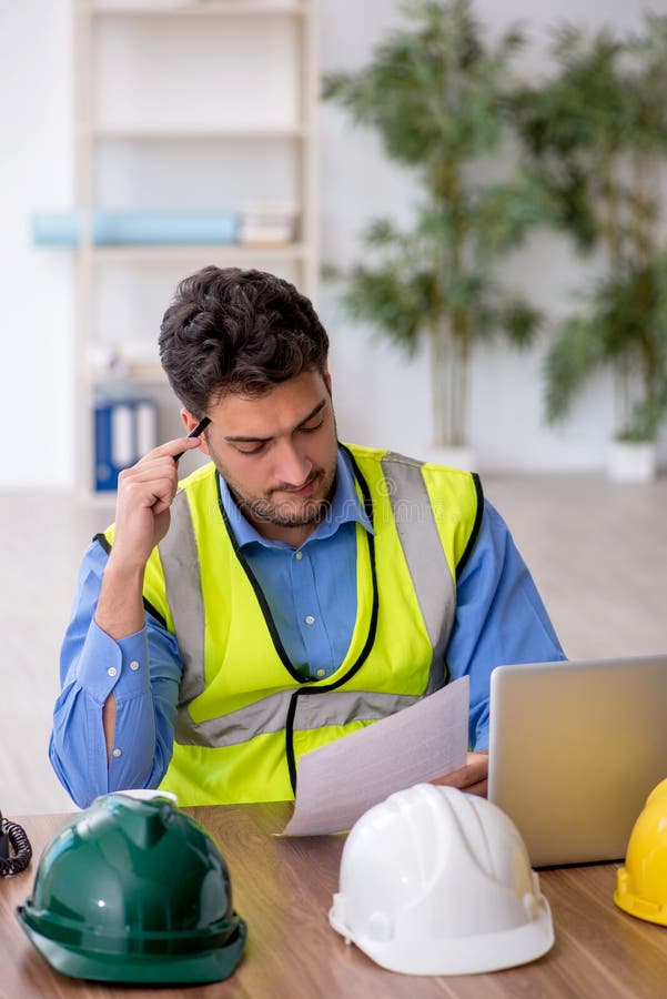 Man Safety Vest Sitting Office Desk Working Computer Warehouse Stock ...