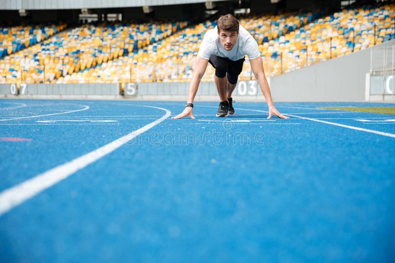 Young Male Athlete Standing in a Start Position Stock Photo - Image of ...