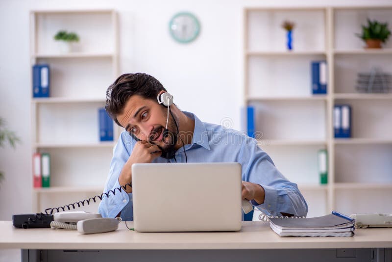 Young Male Call Center Operator Working at His Desk Stock Image - Image ...