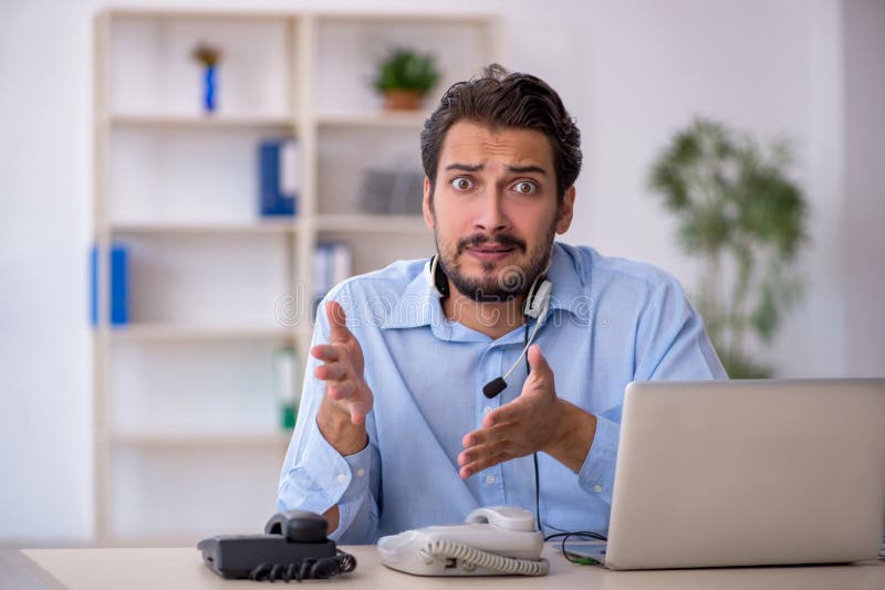 Young Male Call Center Operator Working at His Desk Stock Photo - Image ...