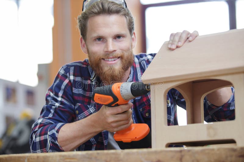 Young Male Carpenter Making Bird Feeder Stock Photo - Image of natural, prepare: 301295026