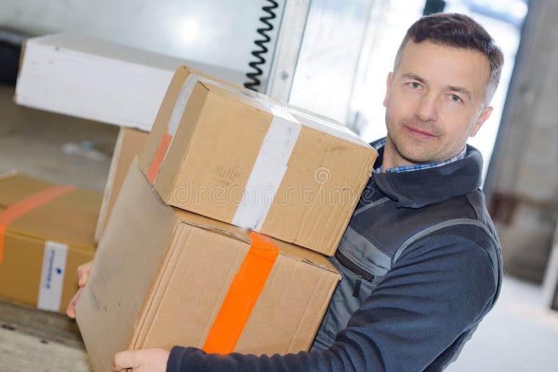 Young Male Carrying Moving Boxes Stock Image - Image of carry, delivery ...