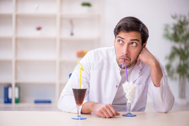 Young Male Chemist Examining Soft Drink at the Lab Stock Image - Image ...