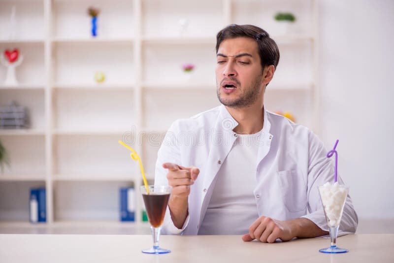 Young Male Chemist Examining Soft Drink at the Lab Stock Photo - Image ...