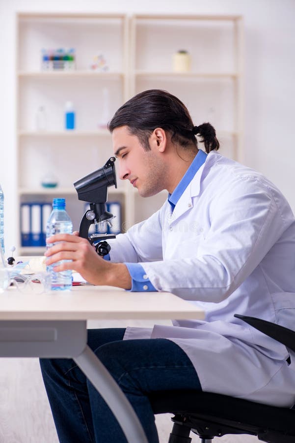Young Male Chemist Experimenting in Lab Stock Photo - Image of ...