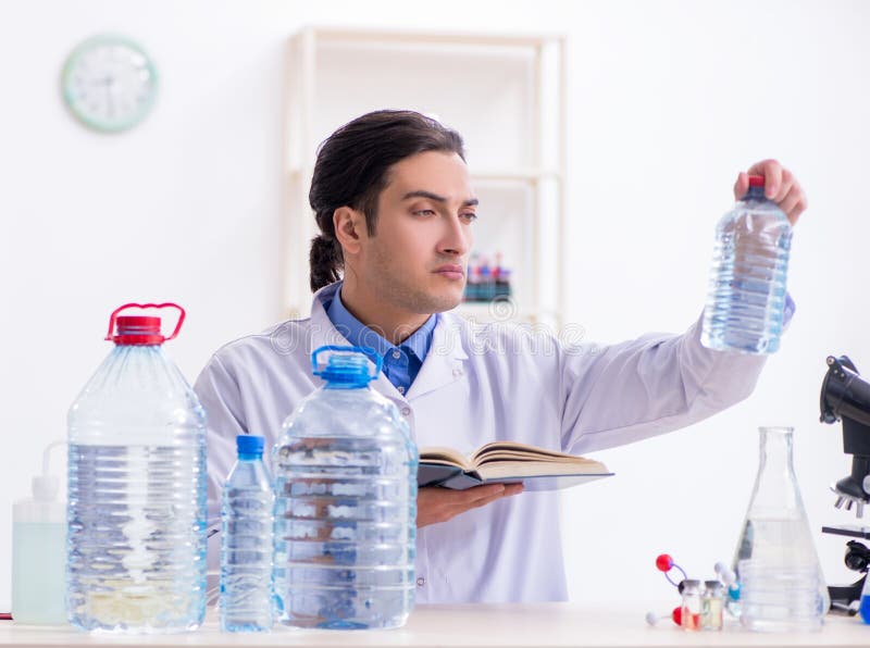Young Male Chemist Experimenting in Lab Stock Photo - Image of ...