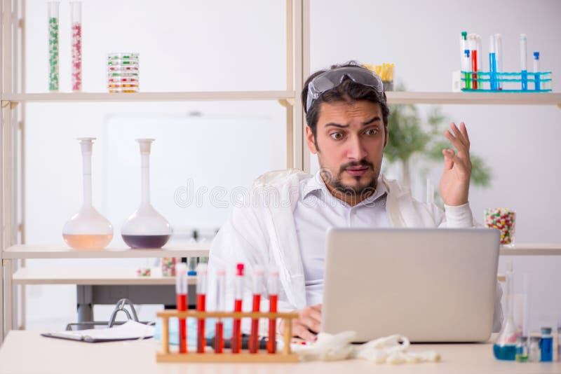 Young Male Chemist Sitting at Computer at the Lab Stock Image - Image ...