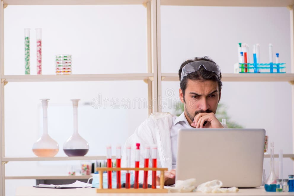 Young Male Chemist Sitting at Computer at the Lab Stock Image - Image ...