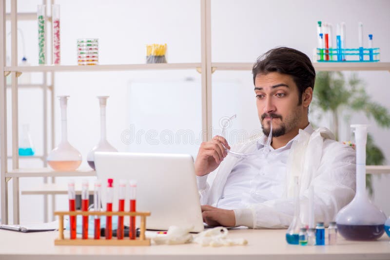 Young Male Chemist Sitting at Computer at the Lab Stock Photo - Image ...