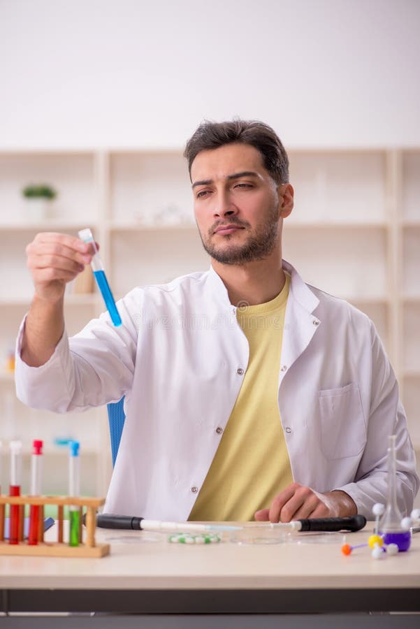 Young Male Chemist Sitting at the Lab Stock Image - Image of ...