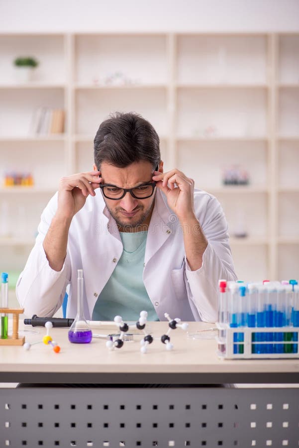 Young Male Chemist Sitting at the Lab Stock Photo - Image of scientist ...