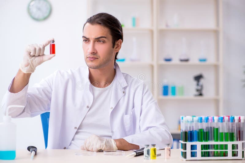 Young Male Chemist Working in the Lab Stock Photo - Image of ...