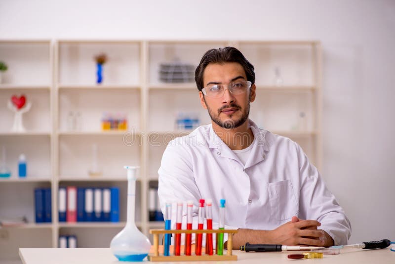 Young Male Chemist Working at the Lab Stock Photo - Image of laboratory ...