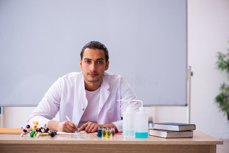 Young Male Chemistry Teacher in the Classroom Stock Photo - Image of ...