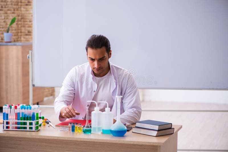 Young Male Chemistry Teacher in the Classroom Stock Photo - Image of ...