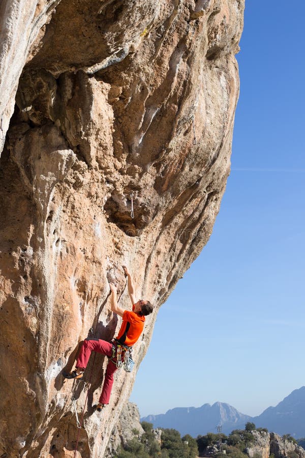 Young Male Climber Hanging by a Cliff. Stock Image - Image of high ...