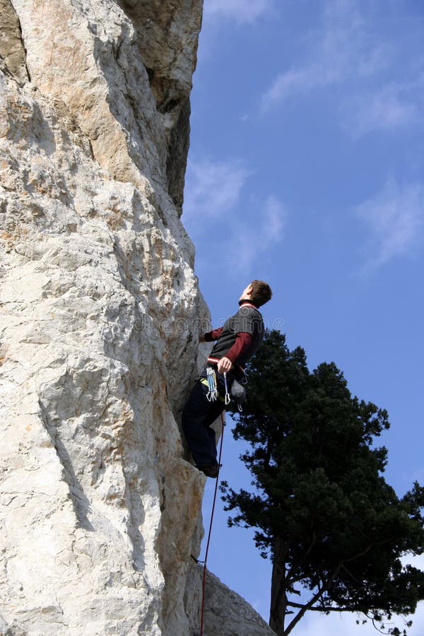 Young Male Climber Hanging by a Cliff. Stock Image - Image of mountain ...