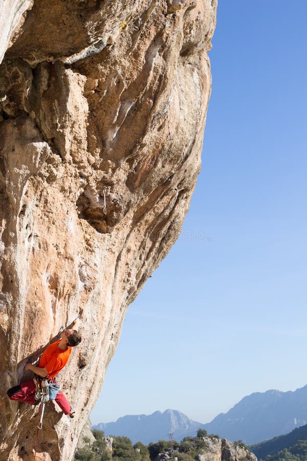 Young Male Climber Hanging by a Cliff Stock Image - Image of effort ...