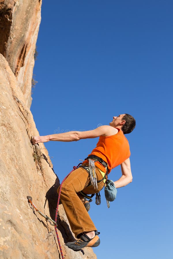 Young Male Climber Hanging by a Cliff. Stock Photo - Image of climb ...