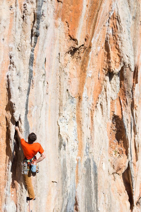 Young Male Climber Hanging by a Cliff. Stock Image - Image of fearless ...
