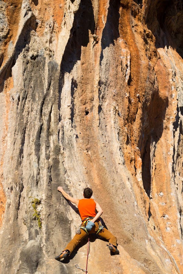Young Male Climber Hanging by a Cliff. Stock Photo - Image of climbing ...