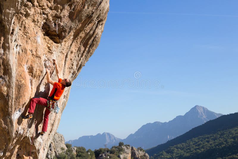Young Male Climber Hanging by a Cliff. Stock Photo - Image of fingers ...