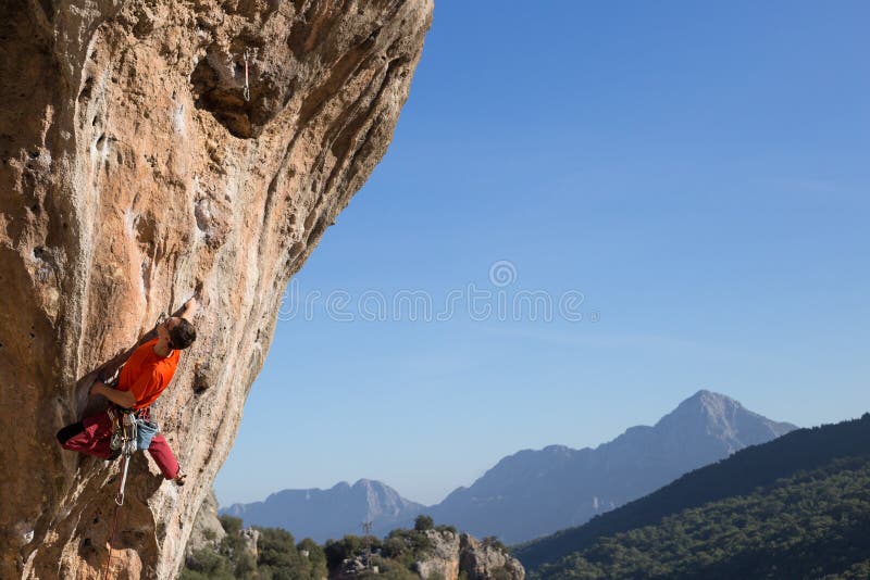 Young Male Climber Hanging by a Cliff Stock Photo - Image of hanging ...
