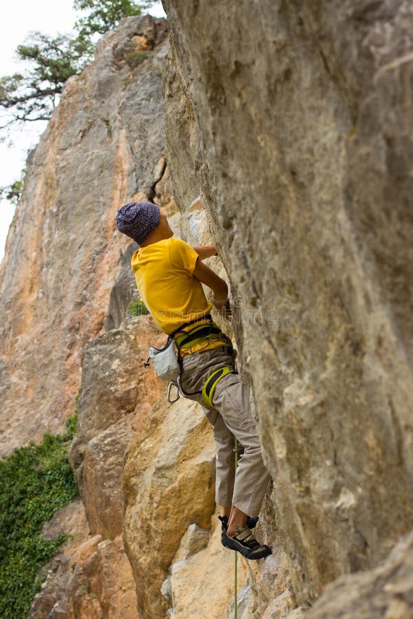 Young Male Climber Hanging by a Cliff. Stock Photo - Image of courage ...