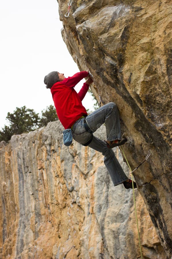 Young Male Climber Hanging by a Cliff. Stock Image - Image of effort ...