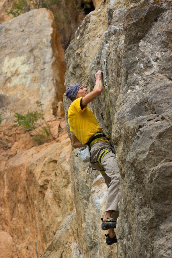 Young Male Climber Hanging by a Cliff. Stock Image - Image of height ...