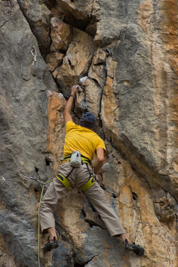 Young Male Climber Hanging by a Cliff. Stock Photo - Image of nature ...