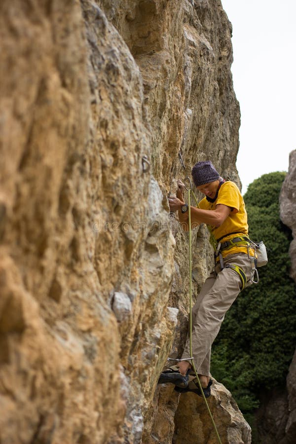 Young Male Climber Hanging by a Cliff. Stock Photo - Image of ...