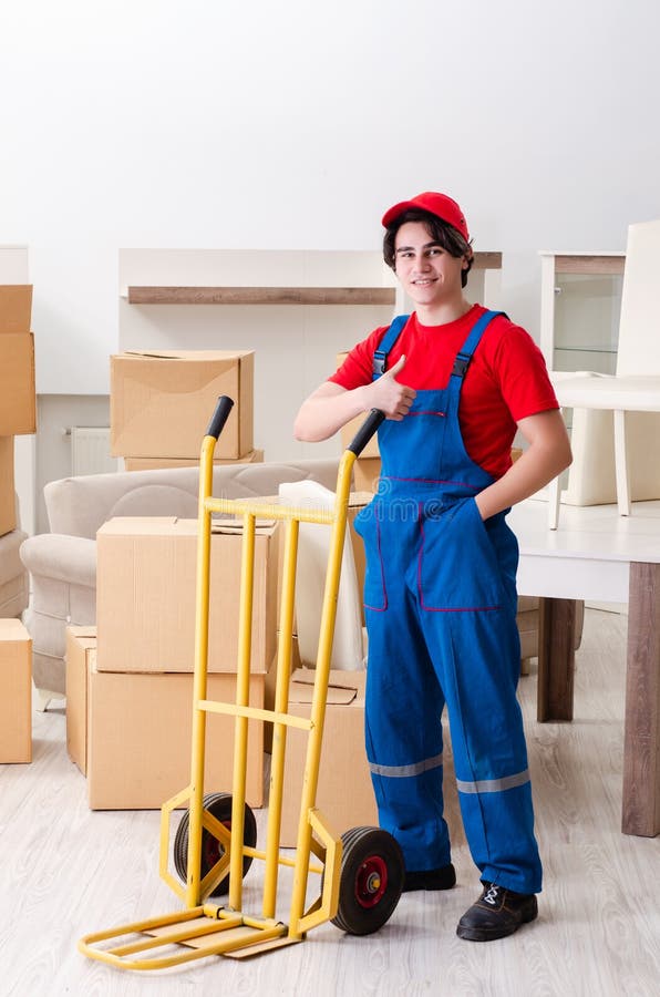 Young Male Contractor with Boxes Working Indoors Stock Photo - Image of ...
