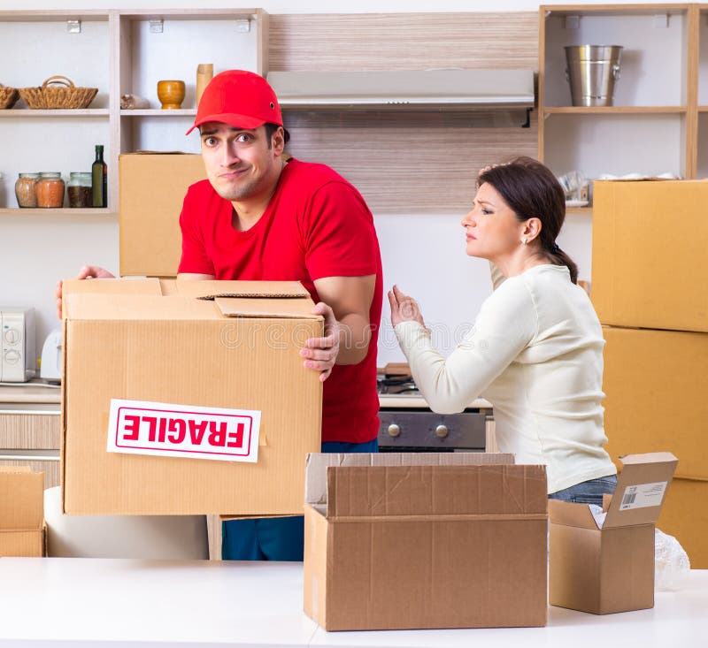 Young Male Contractor and Female Customer in Moving Concept Stock Image ...