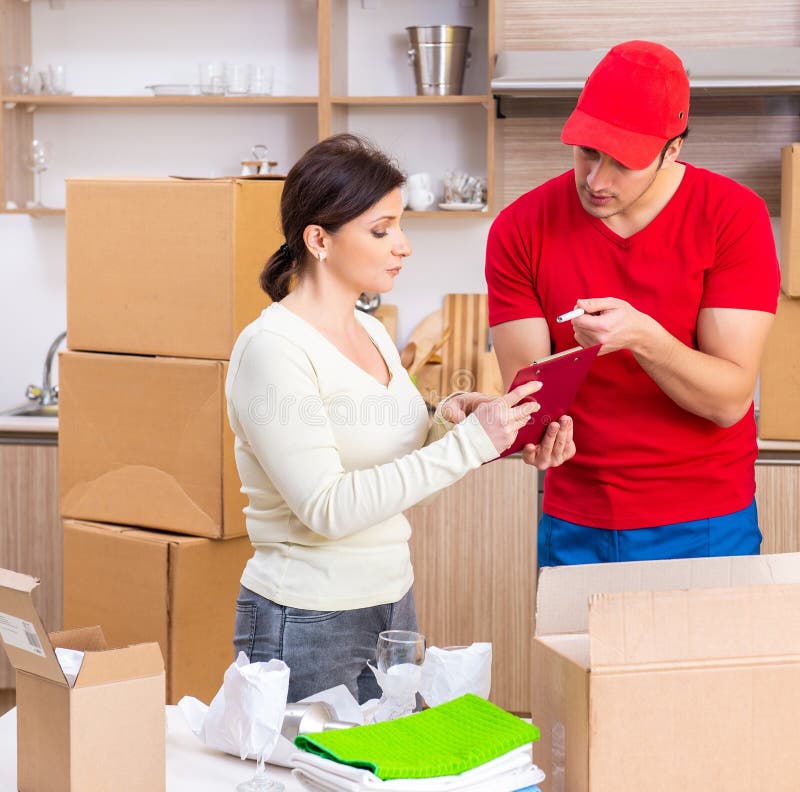 Young Male Contractor and Female Customer in Moving Concept Stock Photo - Image of movement ...