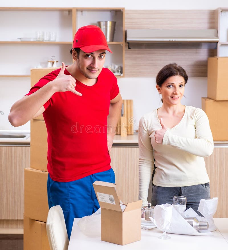 Young Male Contractor and Female Customer in Moving Concept Stock Image ...