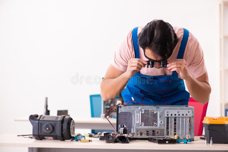 The Young Male Contractor Repairing Computer Stock Image - Image of ...